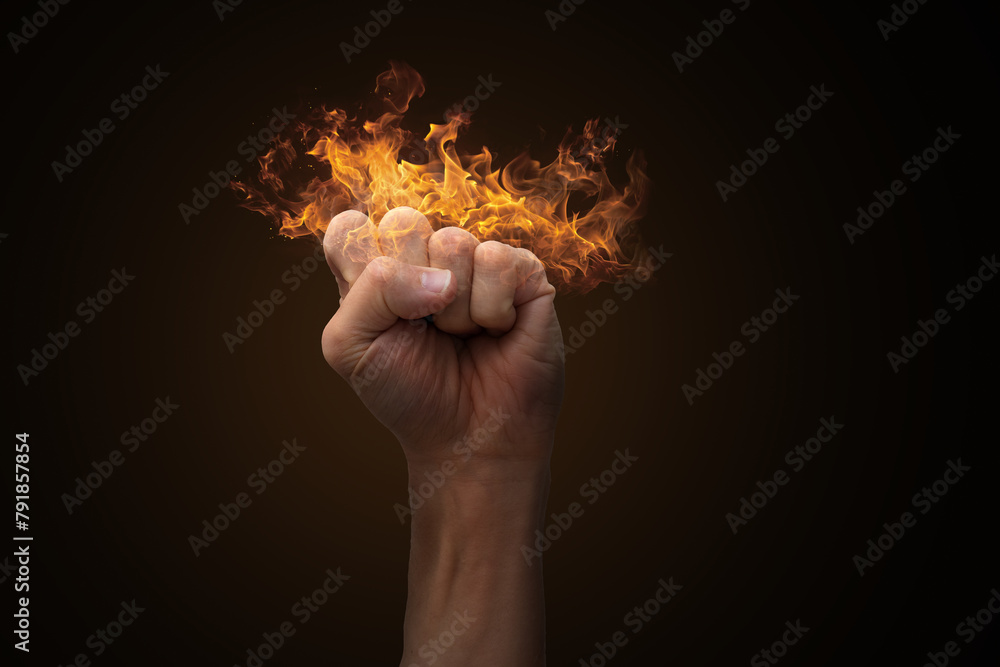 Fist with fire on black background showing concept of strenght and ...