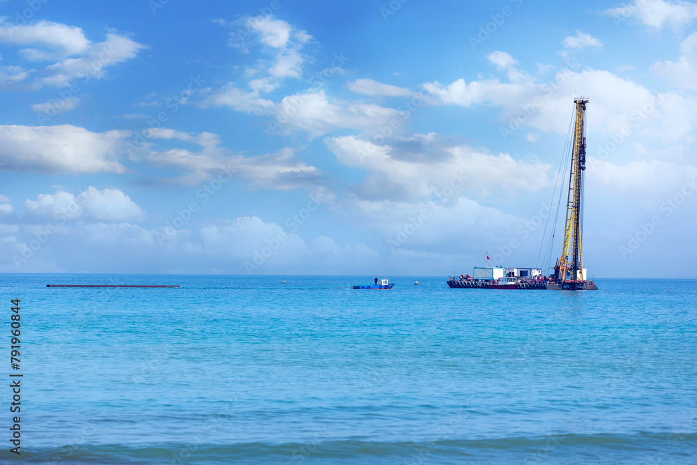 Pile and pile driving for pier installation. During pile driving, steel ...