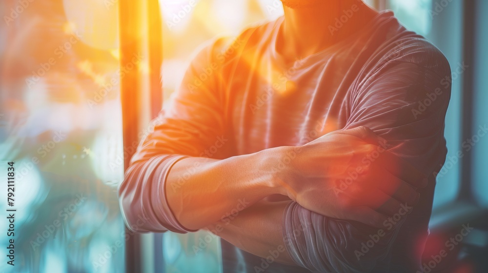 a man support his hand and arm that having symptoms of pain,numbness ...