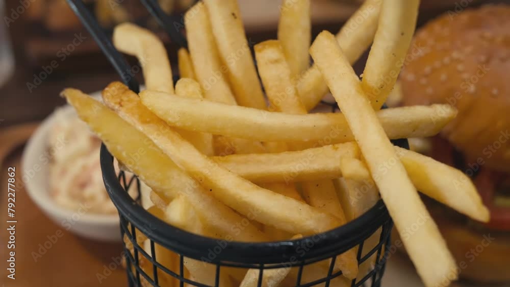 Golden-brown french fries served alongside juicy burger restaurant ...