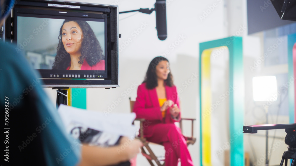 Vibrant On-set Image Of A Young Black Female Host In A Pink Suit ...