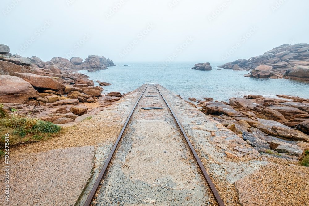 Guide rails for lowering fishing boats on the pink granite coast at ...