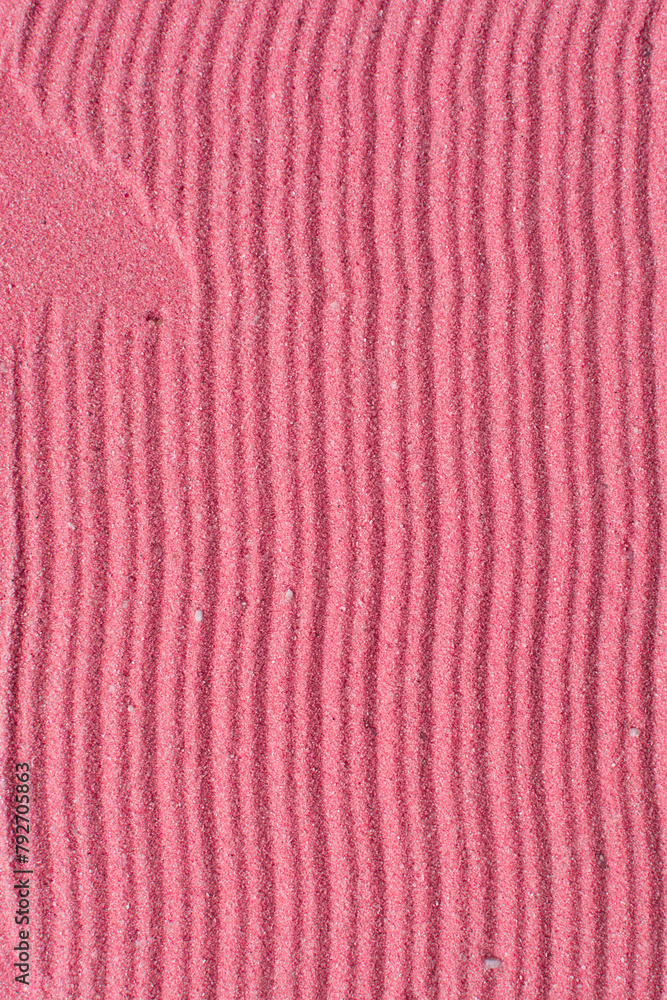 Lines drawn in pink sand background, beautiful sand texture, overhead ...