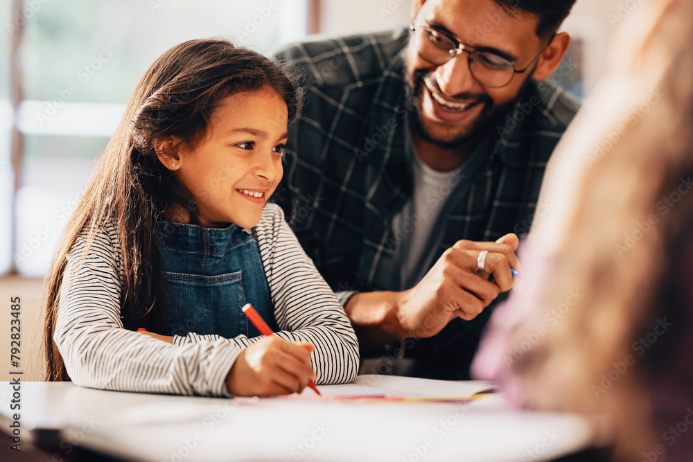 Mentoring children at elementary level. Girl smiles happily as she ...