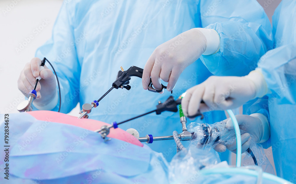 Team doctors use medical instrument for laparoscopic cholecystectomy ...