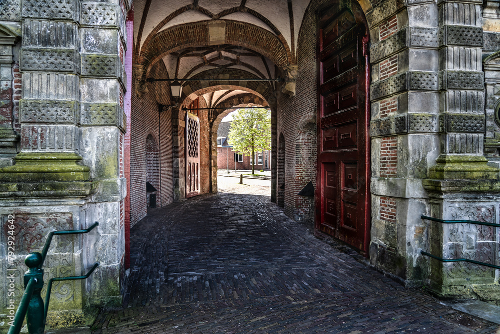 Curved cobblestone path leading through the mannerism architectural ...