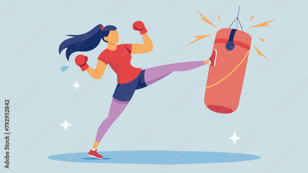 A woman wearing boxing gloves stands in front of a punching bag giving ...