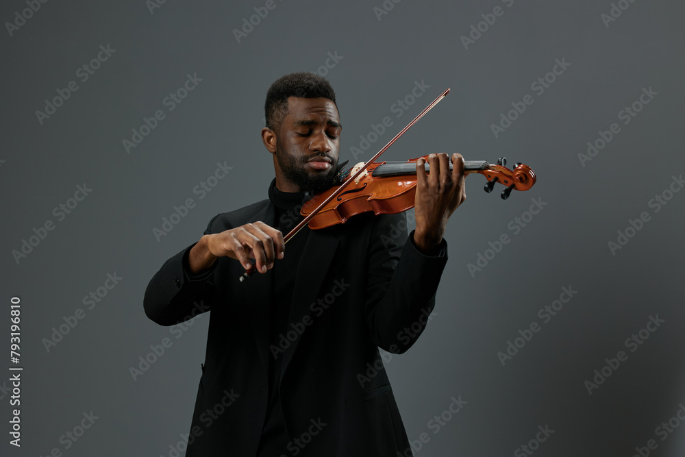 African American male musician in elegant black suit performing on the ...