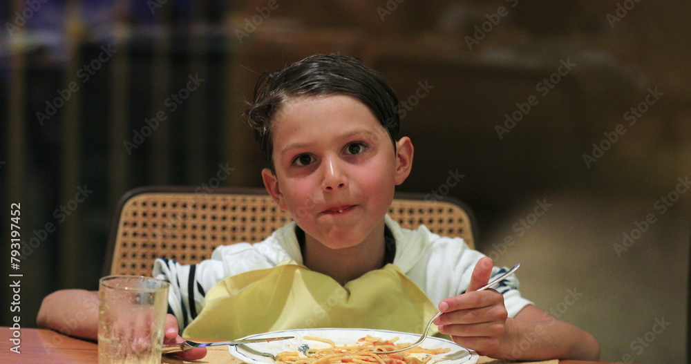 Child eating spaghetti for dinner young boy eating supper Stock Photo ...