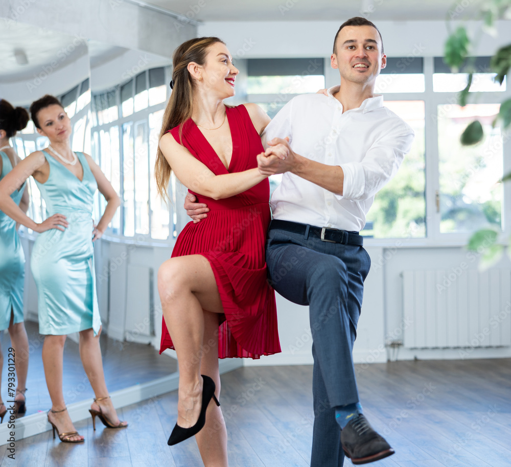 Couple learns dancing during individual lesson in classical and modern ...