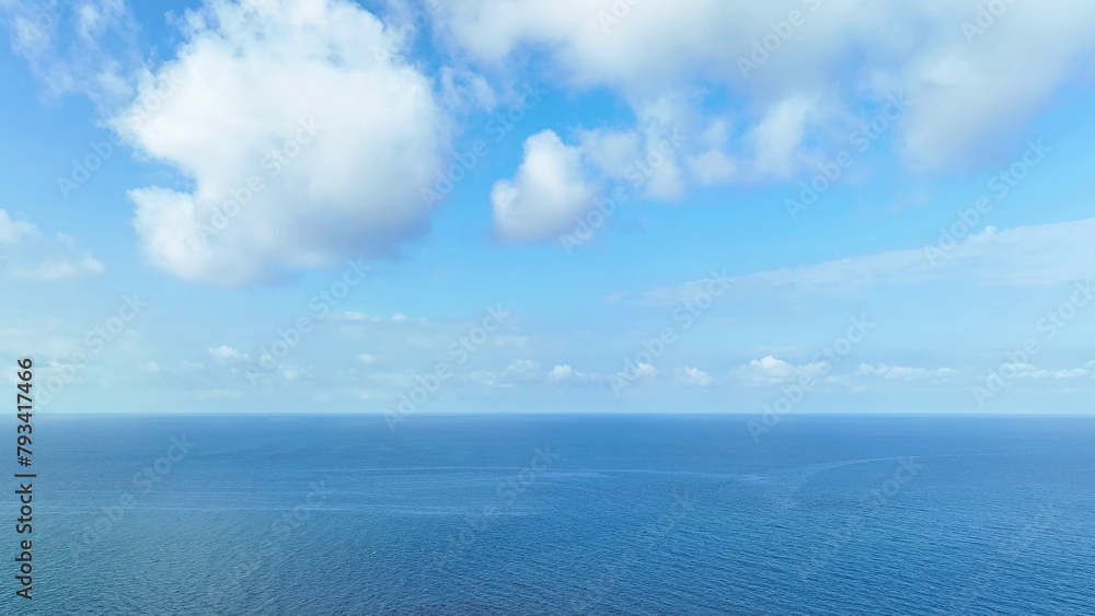 Boundless sea unfolds beneath as drone glides through azure waves ...