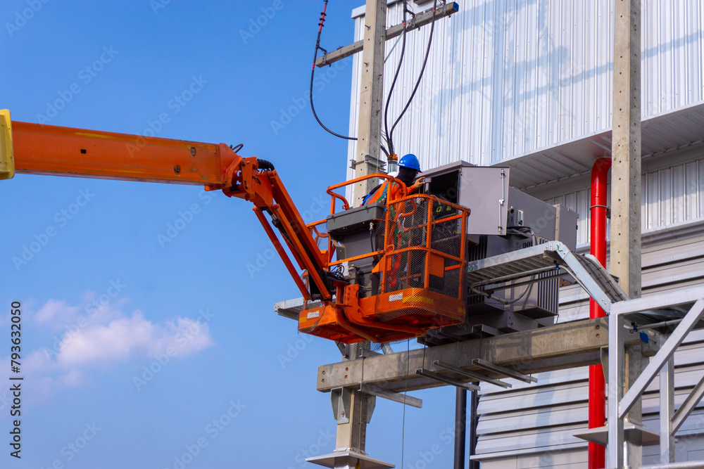 Electrical technician working inspection works on the power transformer ...