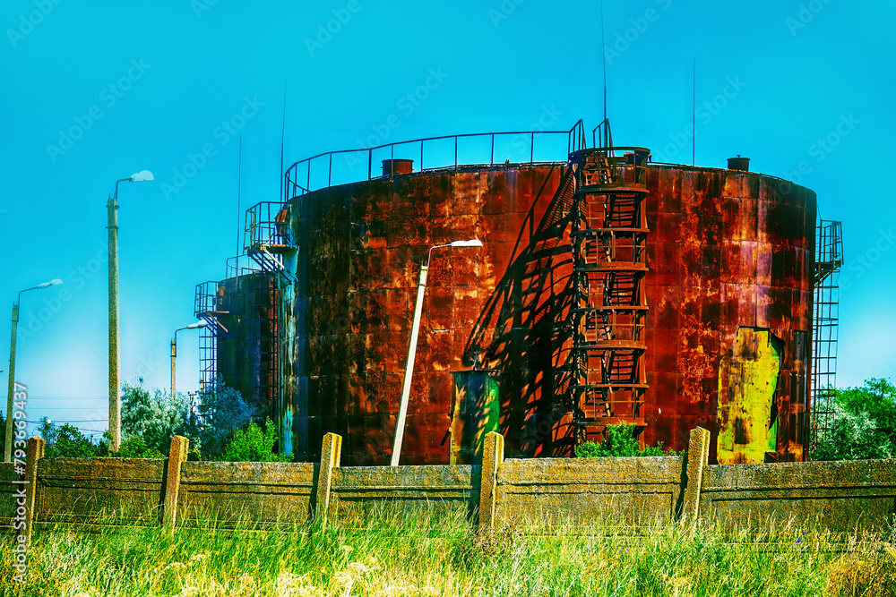 Old rusty oil tanks (fuel reservoir, oil barrel). Evidence of economic ...