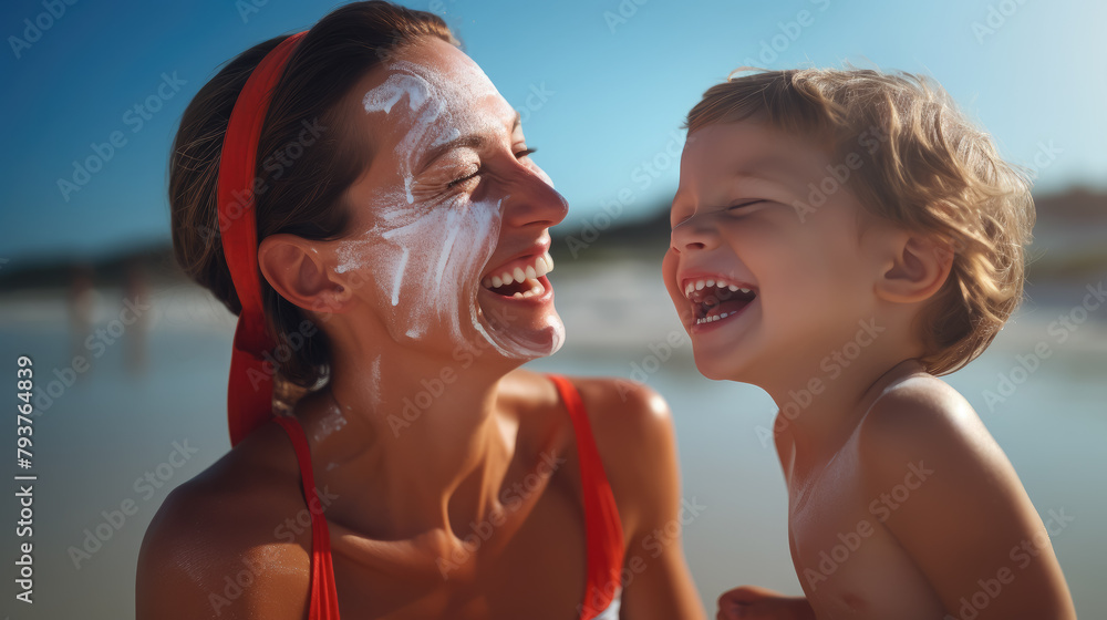 mother smears a cheerful child with sunscreen on the beach, spf, sun ...