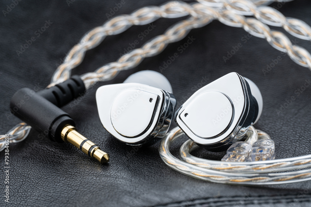 In ear monitor on a tablature background. Custom in-ear monitors with ...