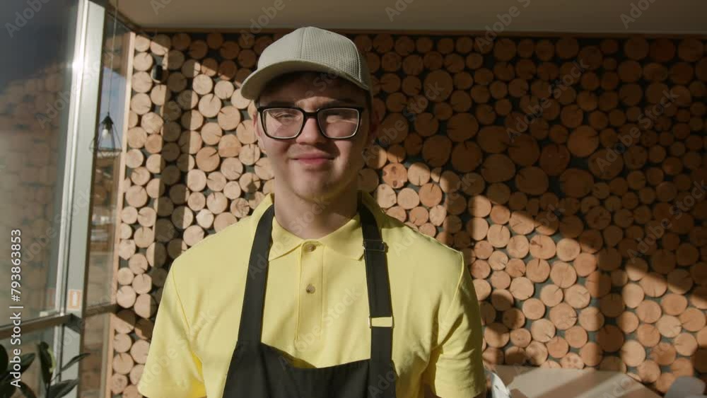 Embracing inclusivity, a cafe worker with neurodiversity holding pizza ...