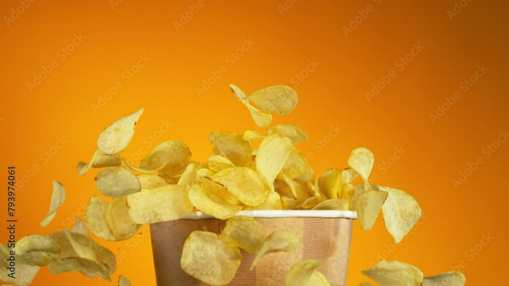 Super Slow Motion of Flying Fried Potatoes Chips for Bucket. Isolated ...
