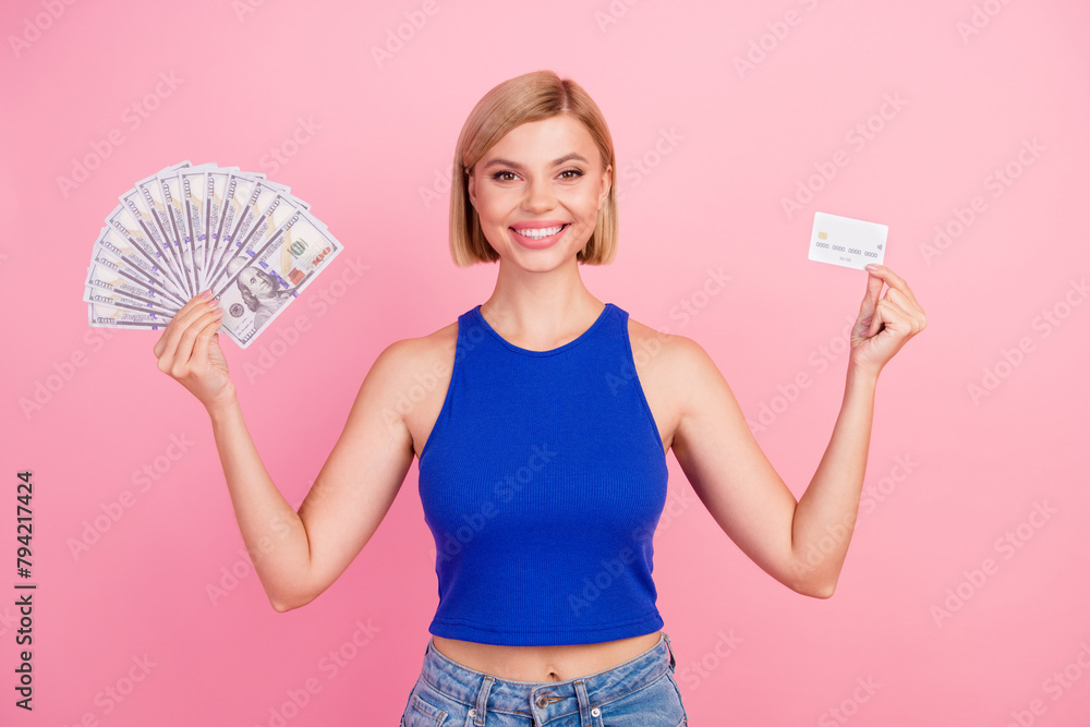 Portrait of nice young girl hold money bills debit card wear blue top ...