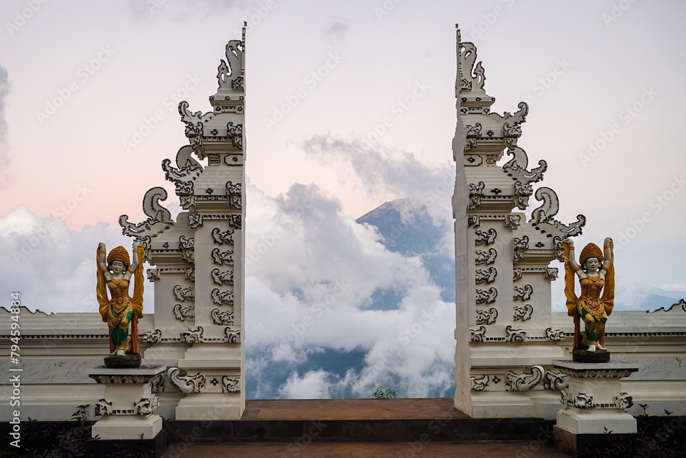 Traditional Balinese temple gate, overlooking the sacred volcano Agung ...