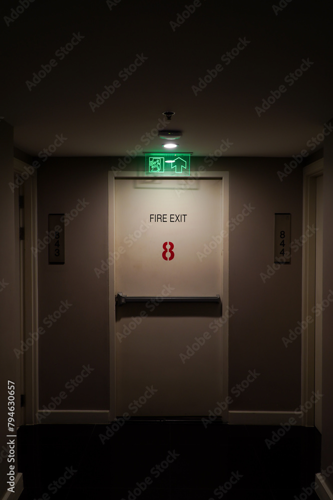 emergency exit sign in hotel room with green light, emergency exit sign ...