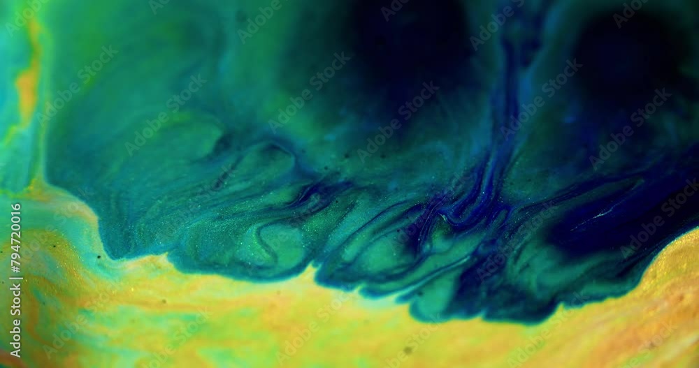 Paint flow. Sparkling fluid wave. Defocused blue indigo golden green ...