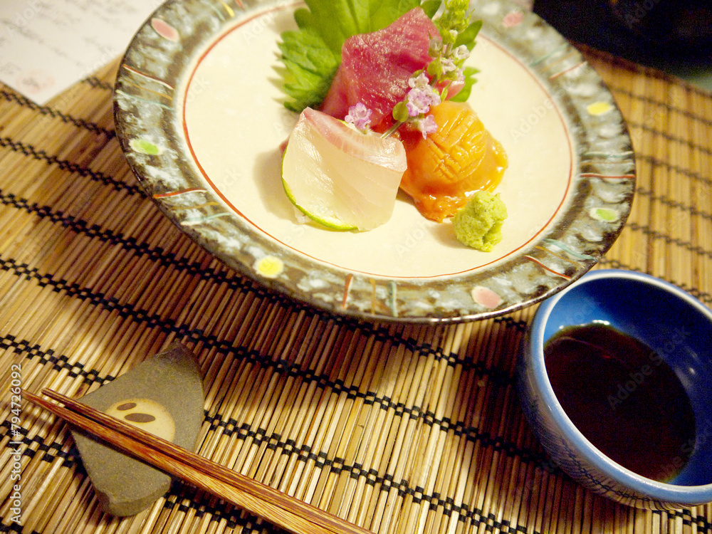 Gourmet Japanese dinner with Fresh Sashimi of tuna and Aka Uni sea ...