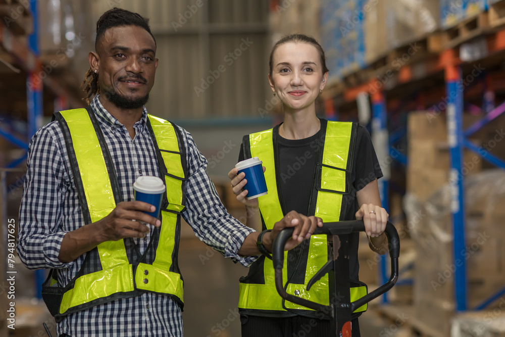 Happy worker having a coffee break in Warehouse. Warehouse worker ...