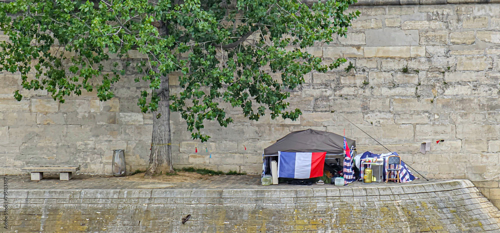 A homeless person’s tent on the banks of the River Siene in Paris ...
