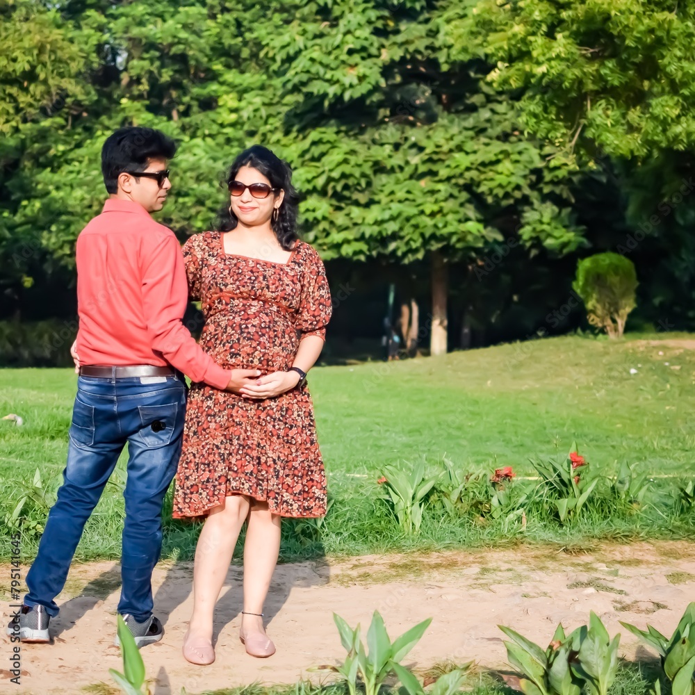 Indian couple posing for Maternity shoot pose for welcoming new born ...