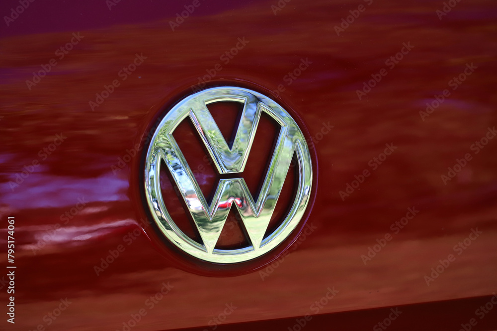 Volkswagen car logo. German car. Close up of red car with German ...