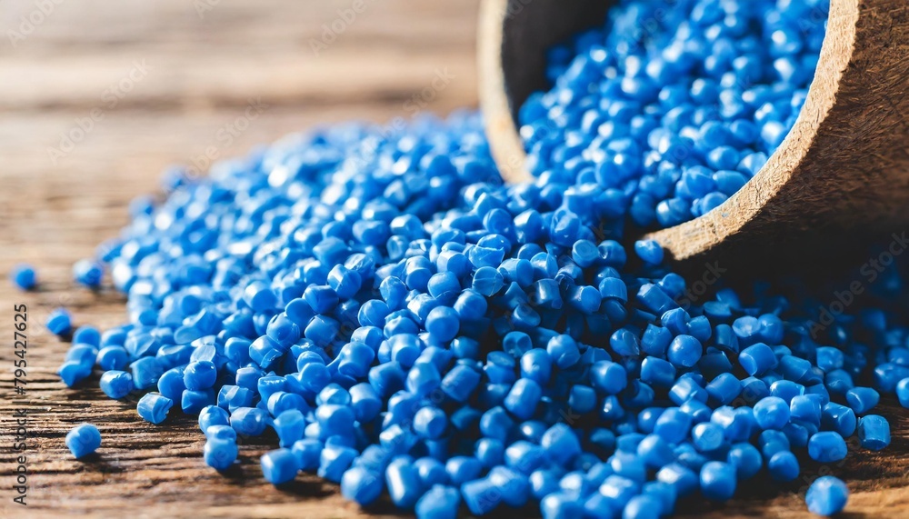blue plastic pellets of uniform texture very small and shiny polymer ...