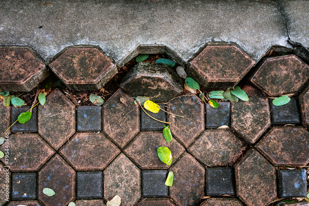 Pavement surface is damaged and dangerous. Broken brick blocks can pose ...