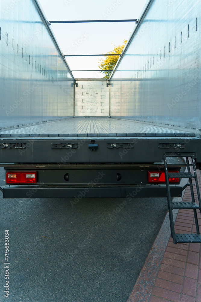 Interior view of an empty semi-trailer van for cargo transportation ...