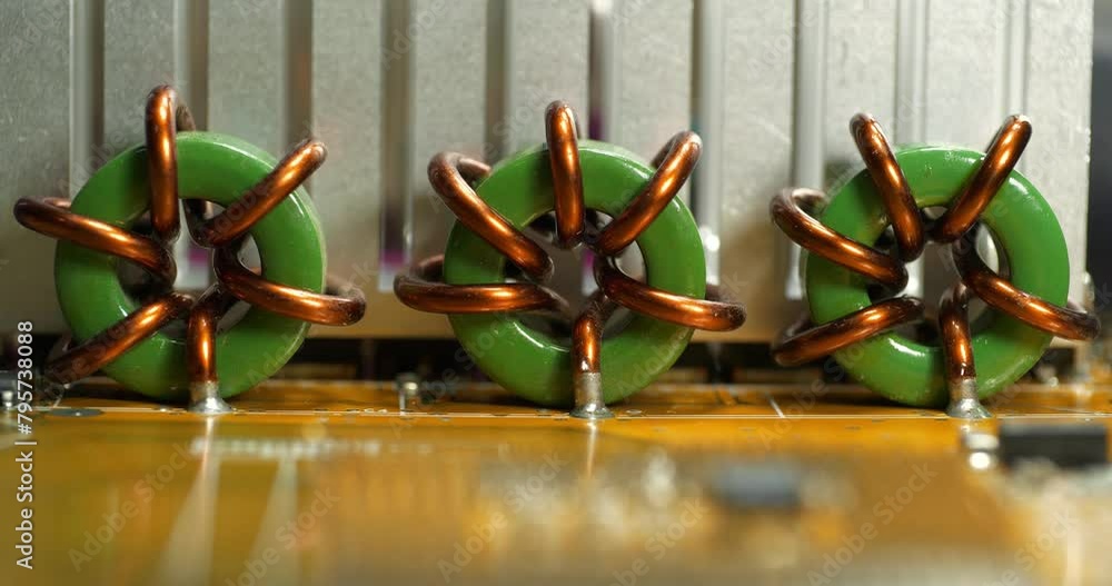 Elements of personal computer motherboard. Toroidal wire wound coils ...