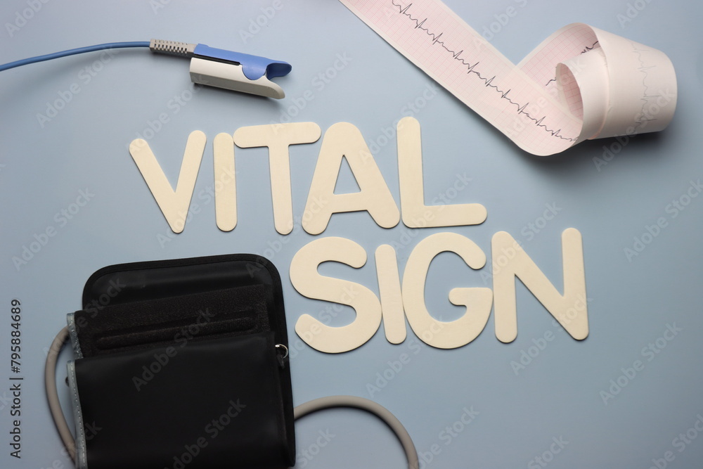 Vital sign words in the middle of the photo with pulse oximeter, blood ...