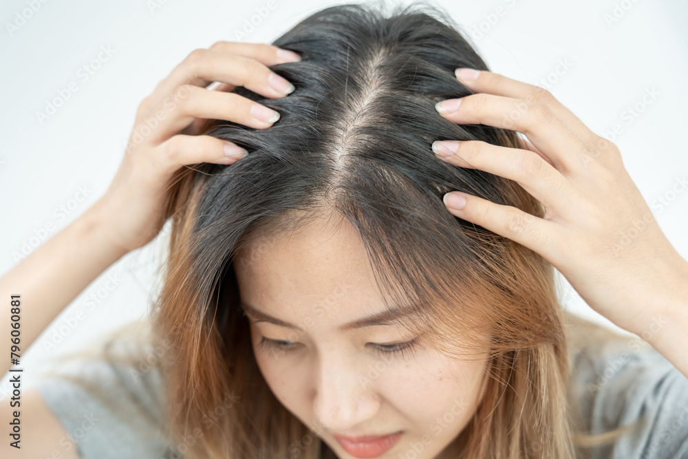 Asian woman very sad and upset looking at damaged hair, hair loss, hair ...