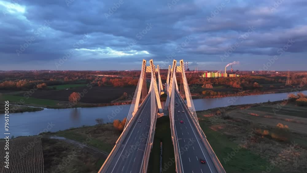 Sunset Silhouette of Cable-Stayed Bridge, Striking silhouette of a ...