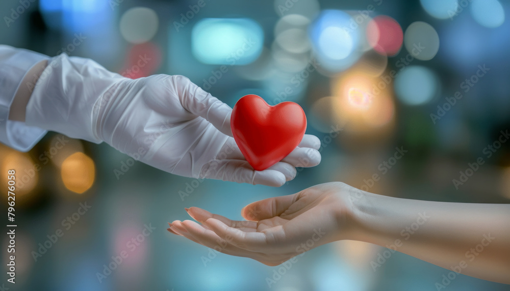Heart transplant and organ donation concept. Hand is giving red heart ...