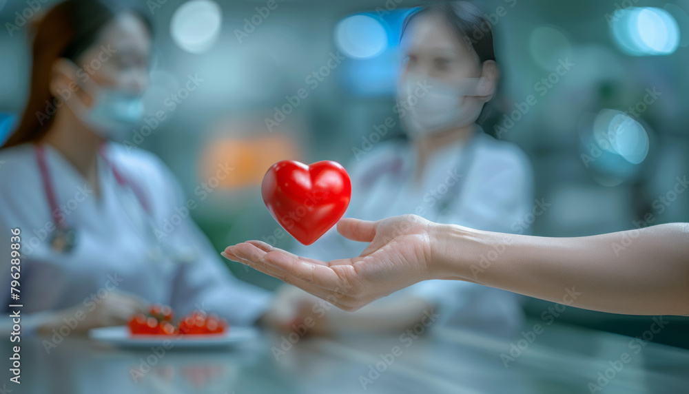 Heart transplant and organ donation concept. Hand is giving red heart ...