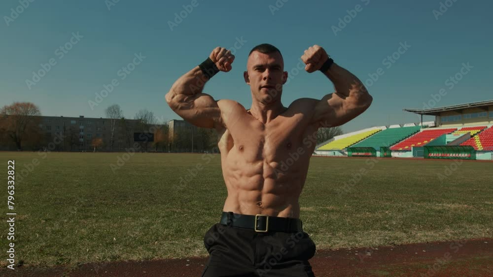 Bodybuilder showing double biceps in front and maximum muscularity ...