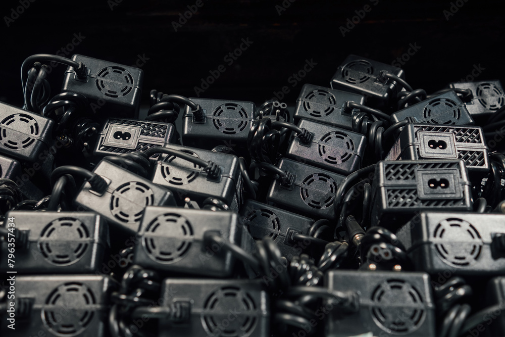 Power adapters. AC to DC converter for e-bikes. Black plastic ...