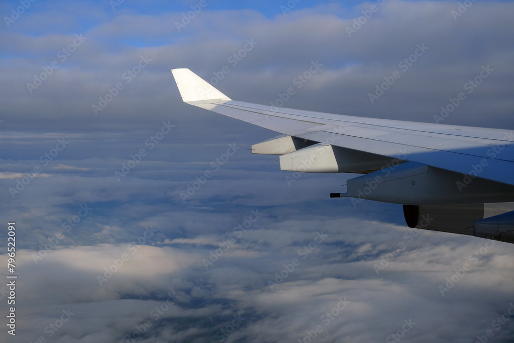 Airbus A340 313 wing and clouds Stock Photo | Adobe Stock