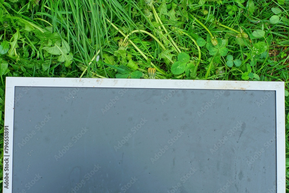 one old broken dirty discarded plastic black computer monitor with a ...