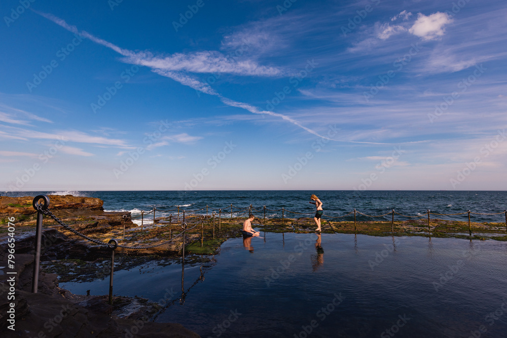 Children swimming in the Bogey Hole, historic man-made rock pool in ...