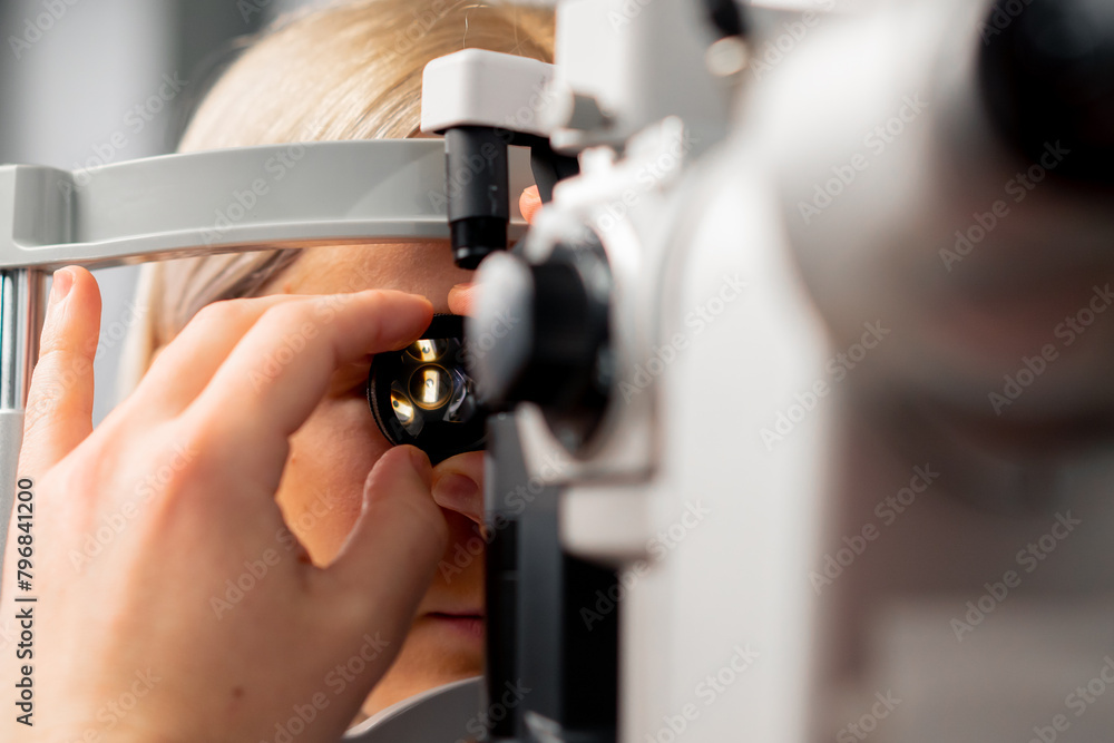close-up in an ophthalmology clinic The girls inserted the lens and ...