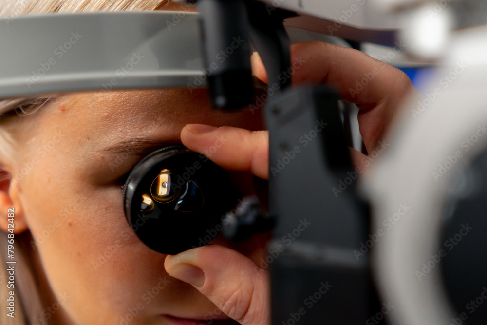 close-up in an ophthalmology clinic The girls inserted the lens and ...