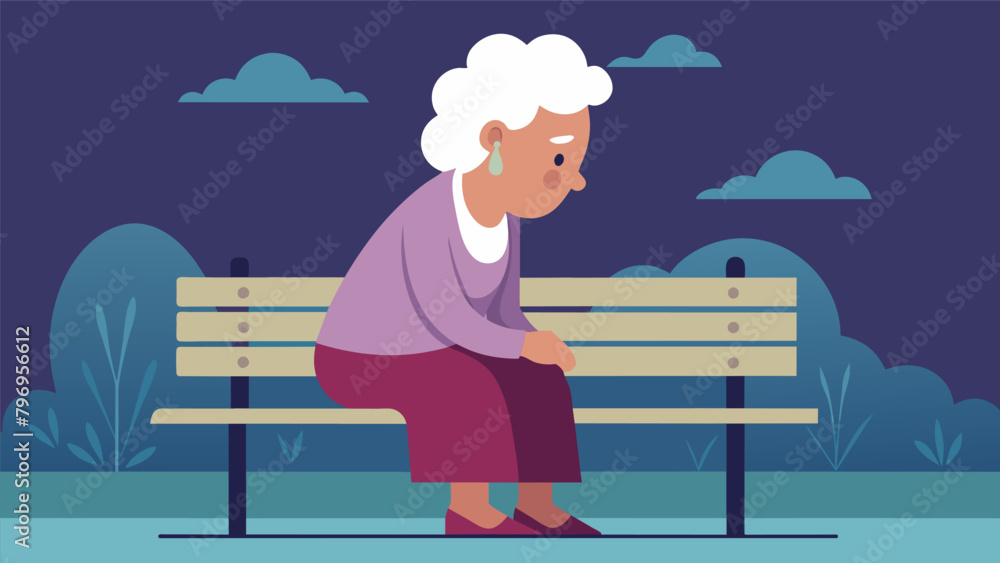An elderly woman sits on a bench tears streaming down her face as she ...