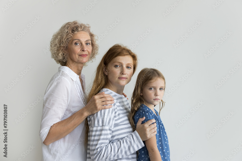 Pretty multi-generational women posing in studio, photography ...
