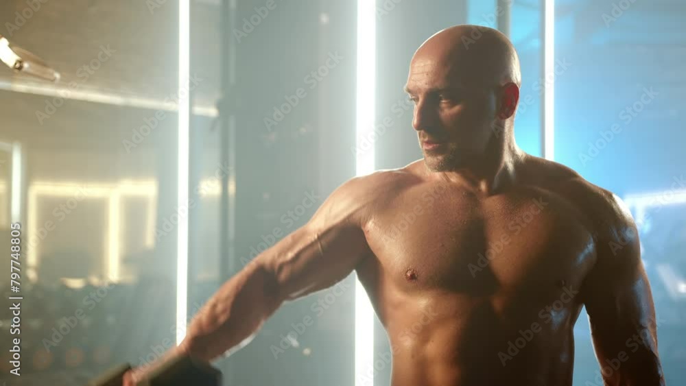 A seasoned bodybuilder lifts a dumbbell with one arm, an exercise that ...