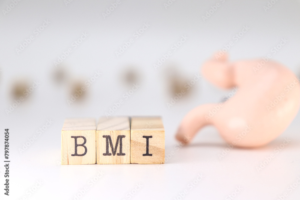 BMI letters Concept of Body mass index with human stomach on white ...